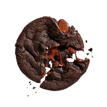 A freshly baked chocolate cookie with melted chocolate chunks and a ...
